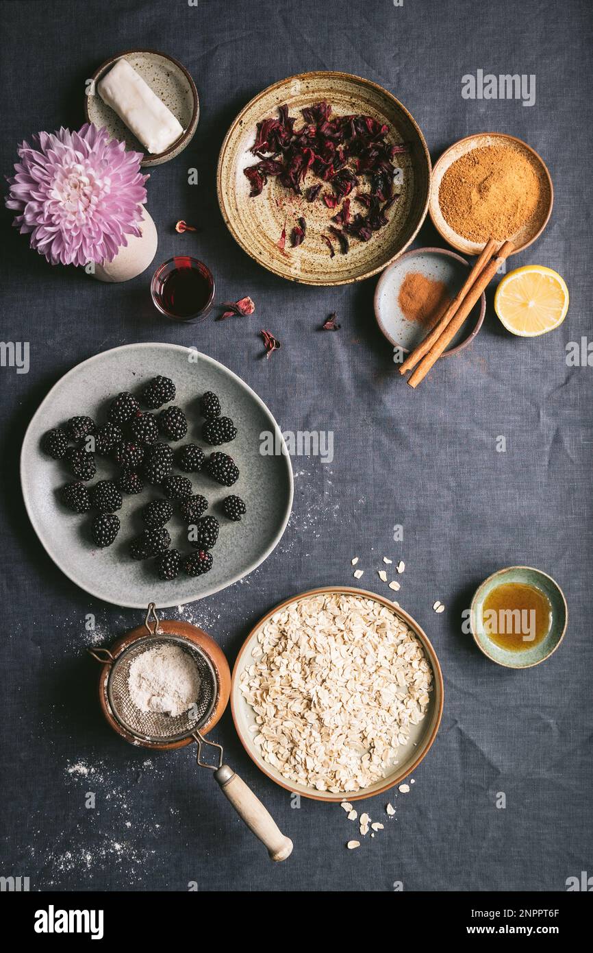 Ingredients to bake blackberry oatmeal breakfast bars Stock Photo - Alamy