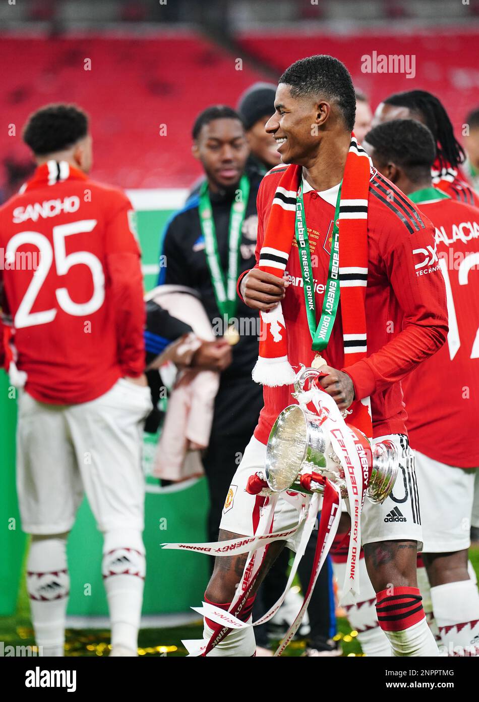 Manchester United's Marcus Rashford celebrates with the trophy ...