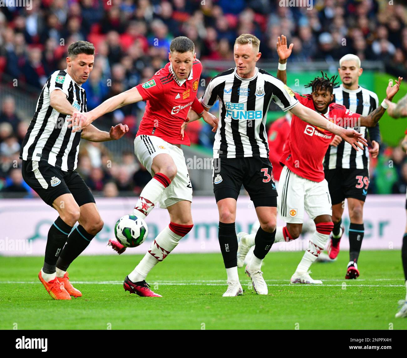 Wembley, London, UK. 26th Feb, 2023. Wout Weghorst Alex Telles of Manchester United attempts to ...