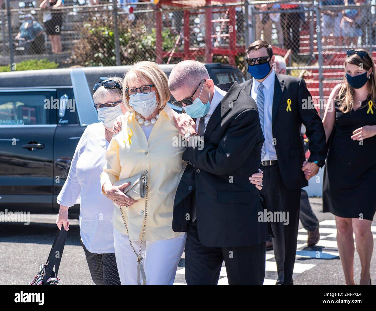 Sandra Bahre, center, arrives at the funeral of her husband, Bob Bahre ...