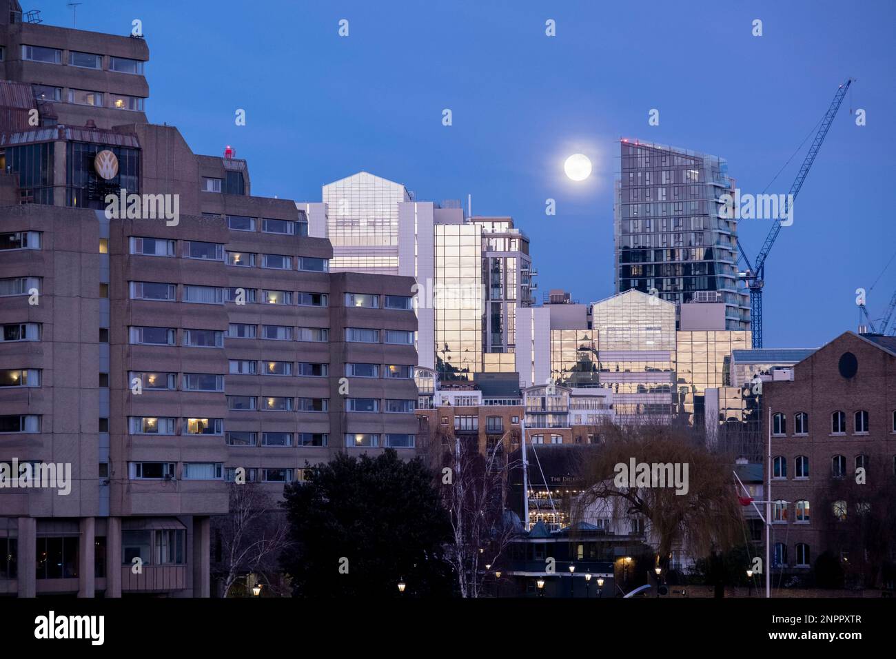 Low moon over buildings in Wapping on 5th Febuary 2023 in London ...