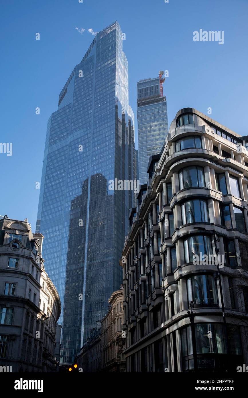 Caution Wet Paint sign on yellow tape cordoning off a small area by ...