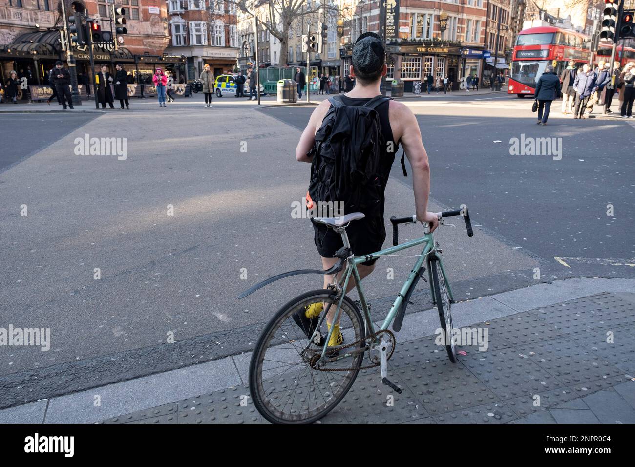 Cyclist waiting to cross the road aith his fixed wheel bicycle aka ...