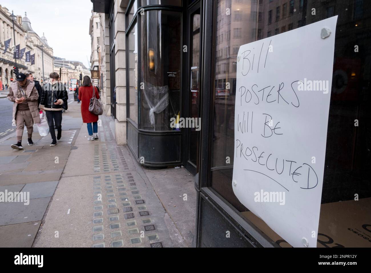 Bill posters will be prosecuted sign in a shop window in Mayfair on ...