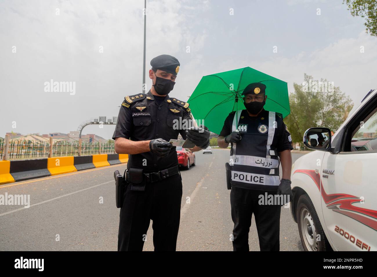 In this July 26, 2020, photo, Saudi security officers check the ...