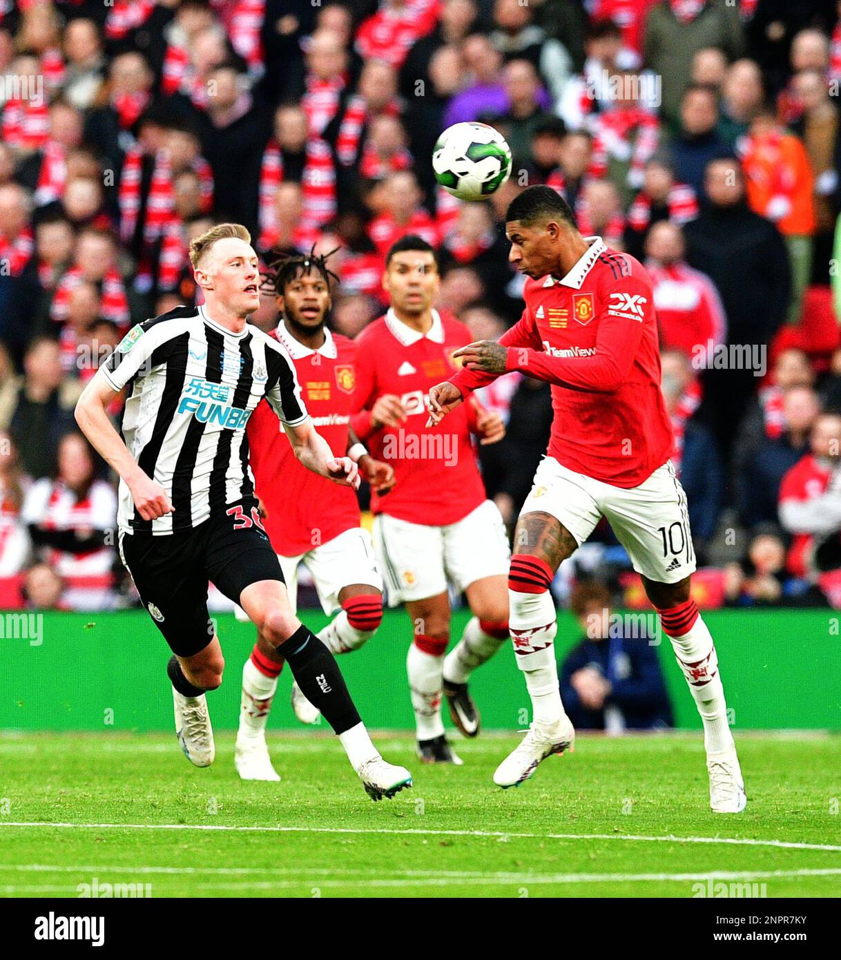 Wembley, London, UK. 26th Feb, 2023. Sean Longstaff of Newcastle United and Marcus Rashford of ...