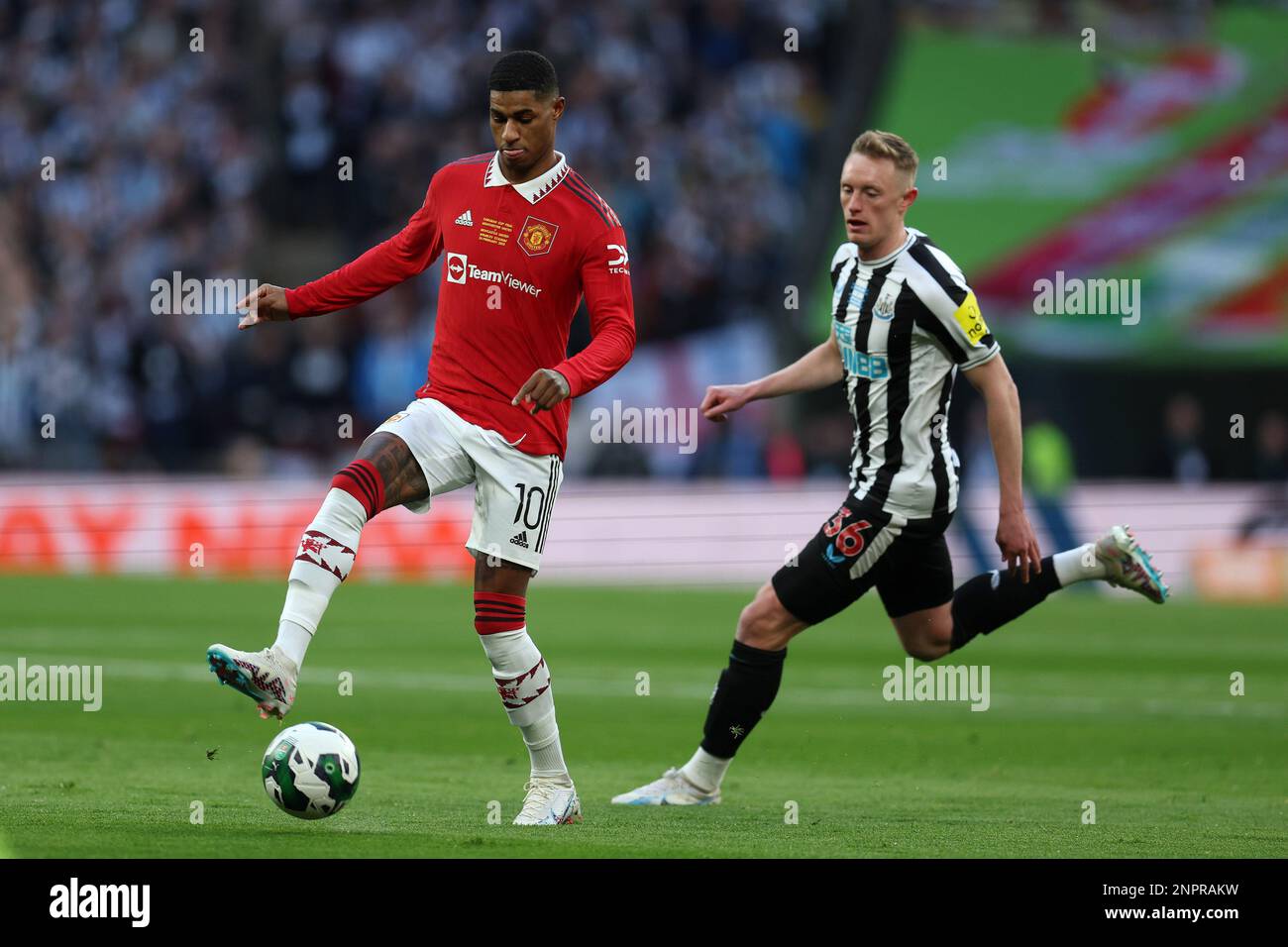 London, UK. 26th Feb, 2023. Marcus Rashford of Manchester Utd (l) and Sean Longstaff of ...