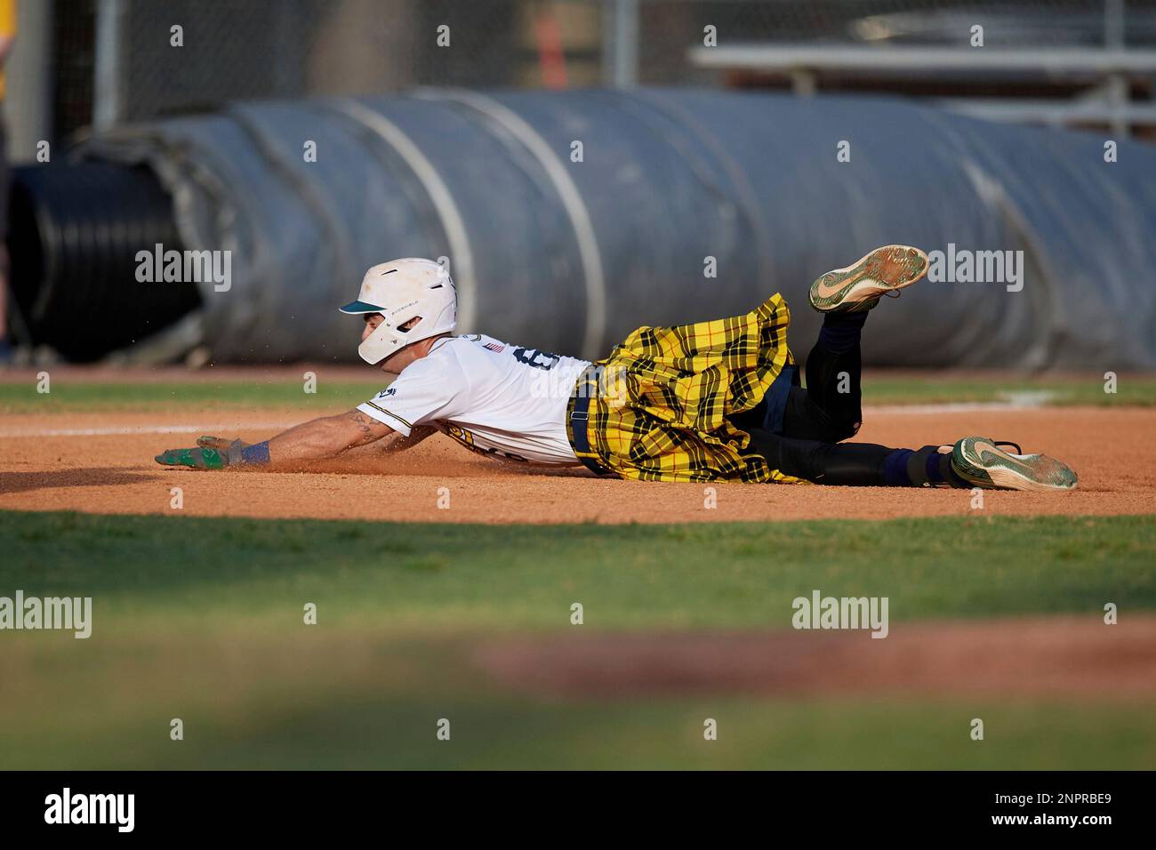 Savannah Bananas Gabe Howell (6) slides head first into third base ...