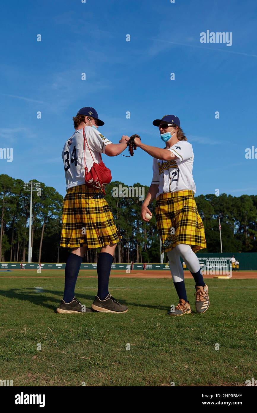 Savannah Bananas Logan Workman (27) fist bumps Eli Ellington (34 ...