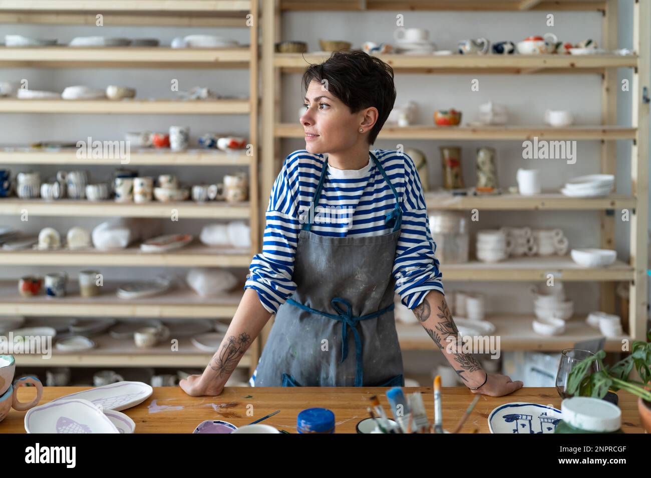 Entrepreneur crafts woman in pottery studio preparing for master class ...