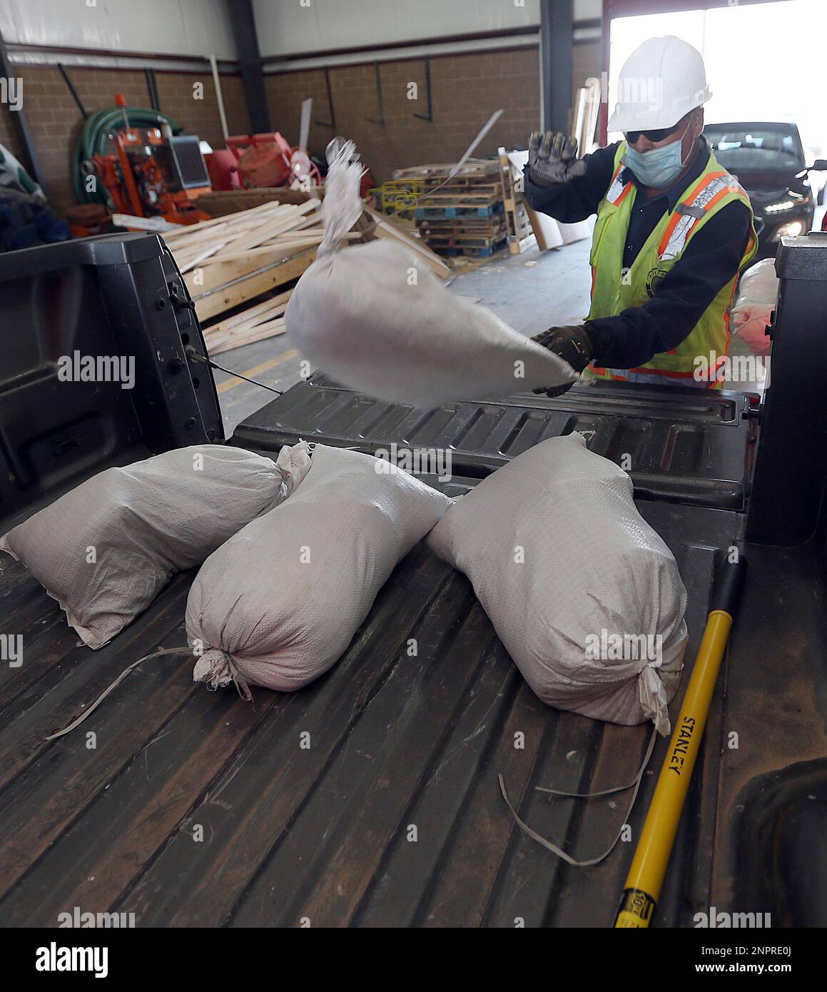Hidalgo County Precinct 4 employees load sand bags in anticipation of ...