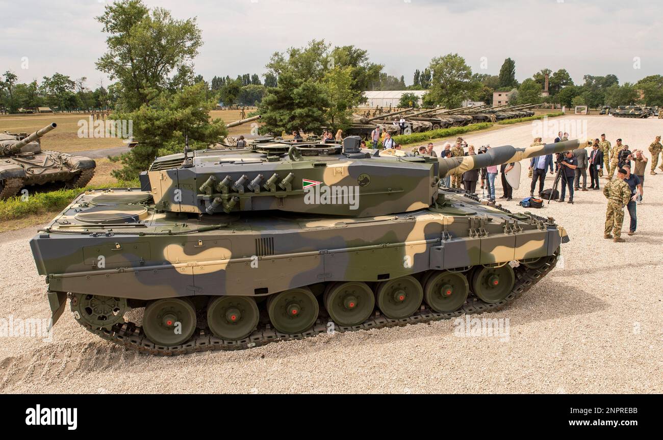 Guests surround one of the new tanks during the ceremonial handover of ...