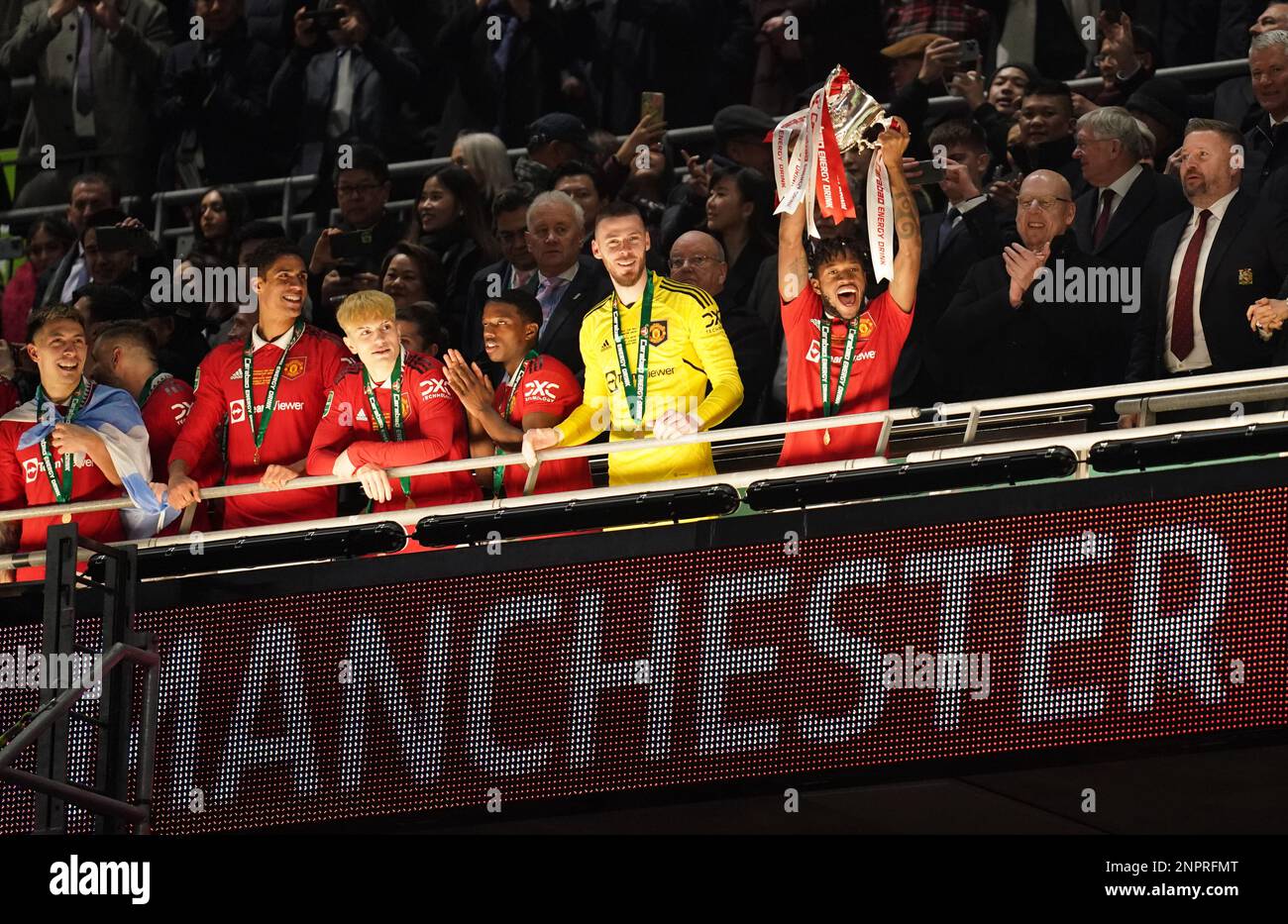 Manchester United's Fred lifts the trophy after winning the Carabao Cup ...
