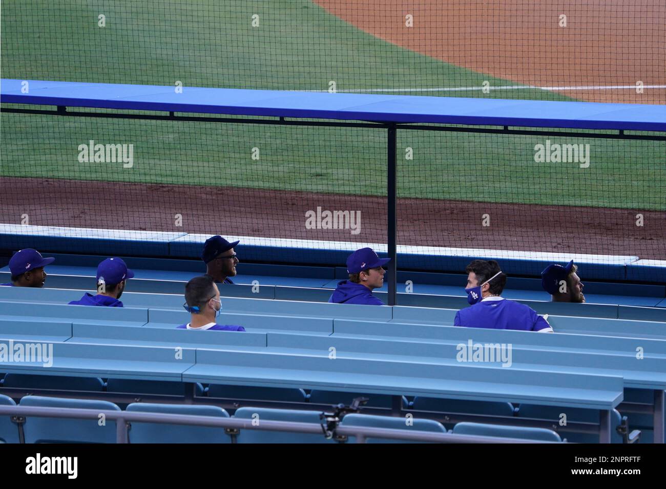 Los Angeles Dodgers players watch from the stands observing social ...