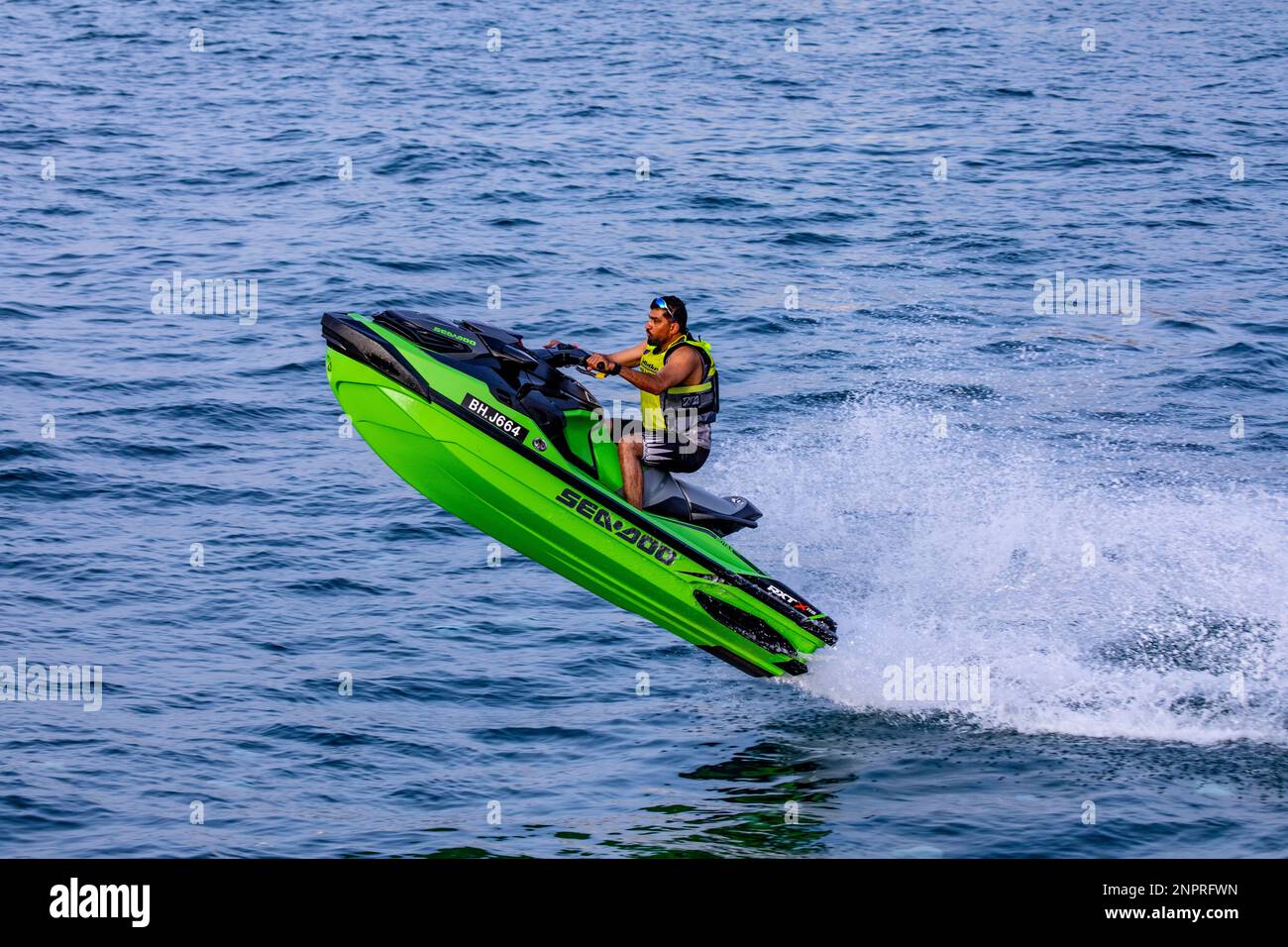 A man with a jet ski or water scooter or personal watercraft in Persian ...