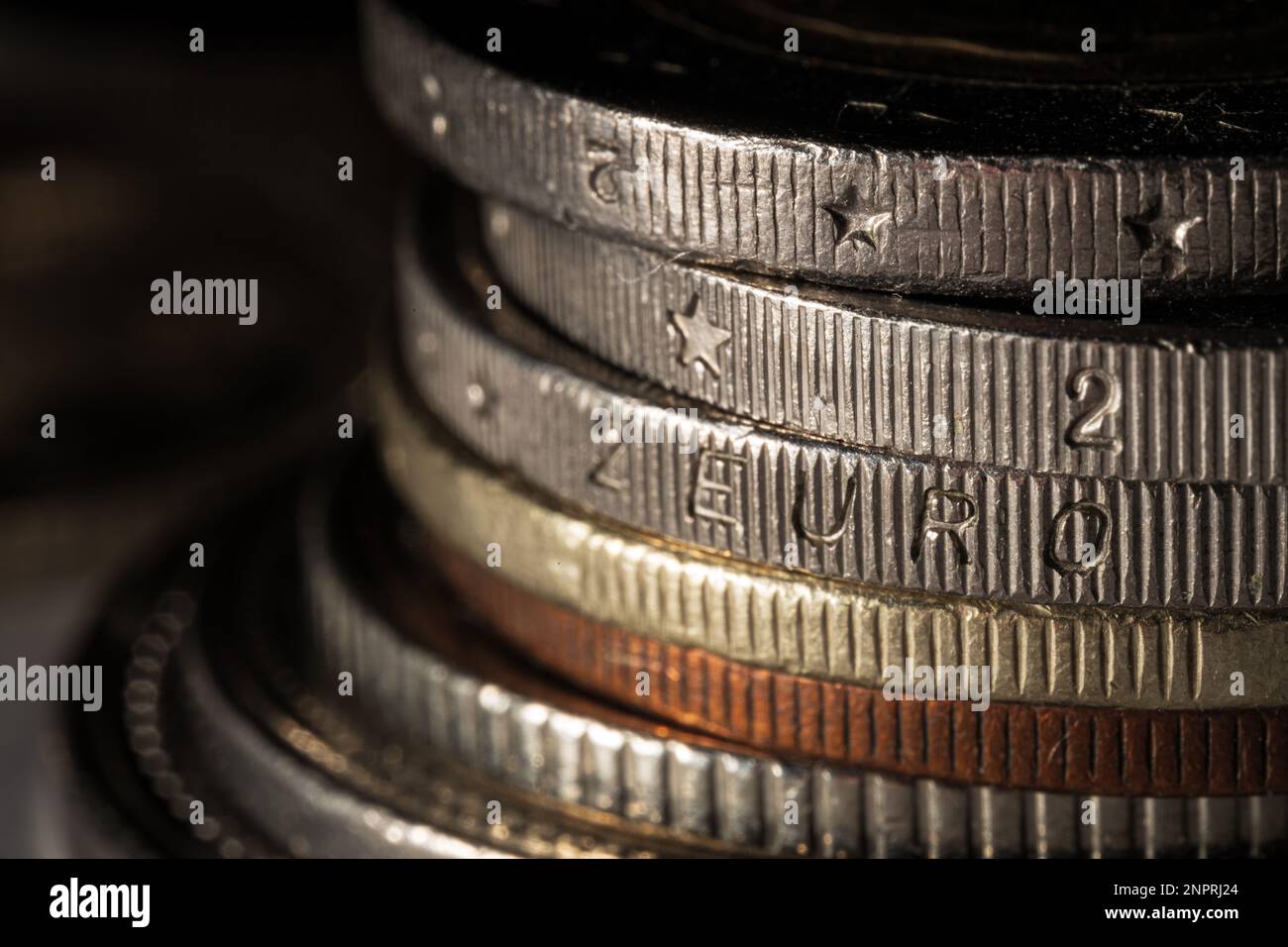 Stack of the coins and Two euro coin edge with soft focus Stock Photo ...