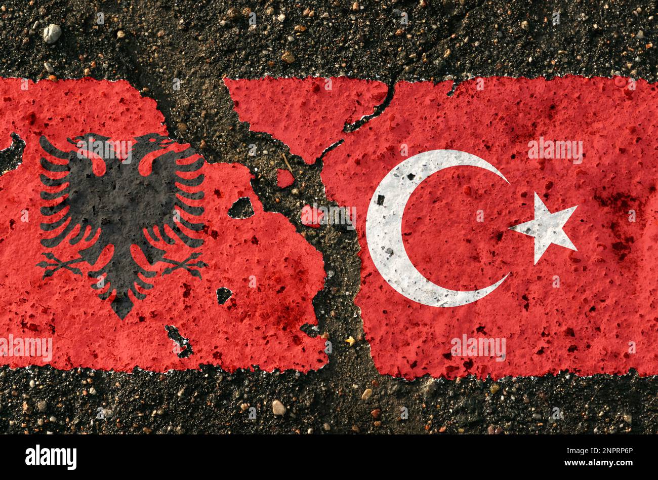 On the pavement there are images of the flags of Albania and Turkey, as ...