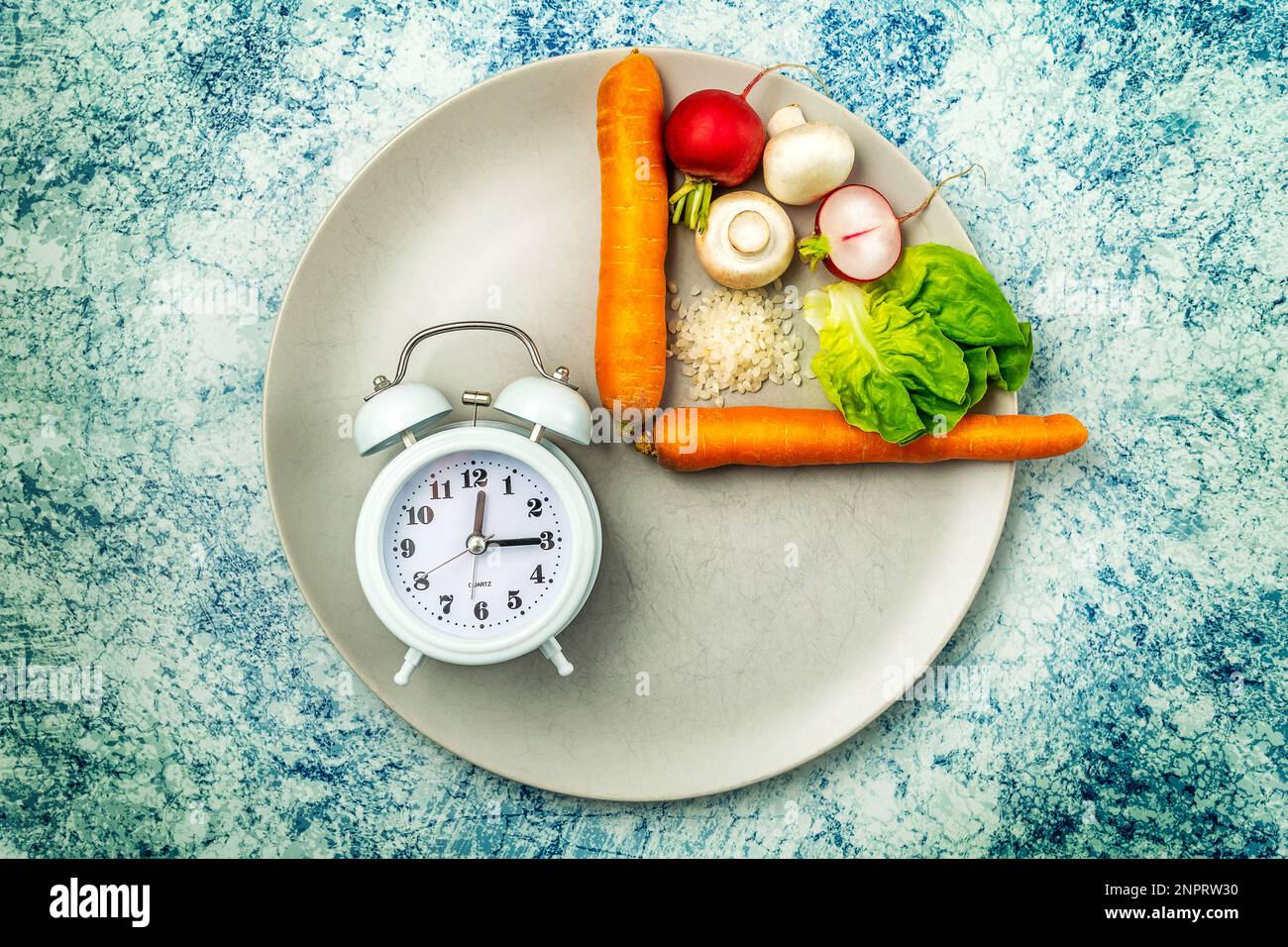 Intermittent fasting diet concept. One fourth plate with healthy food ...