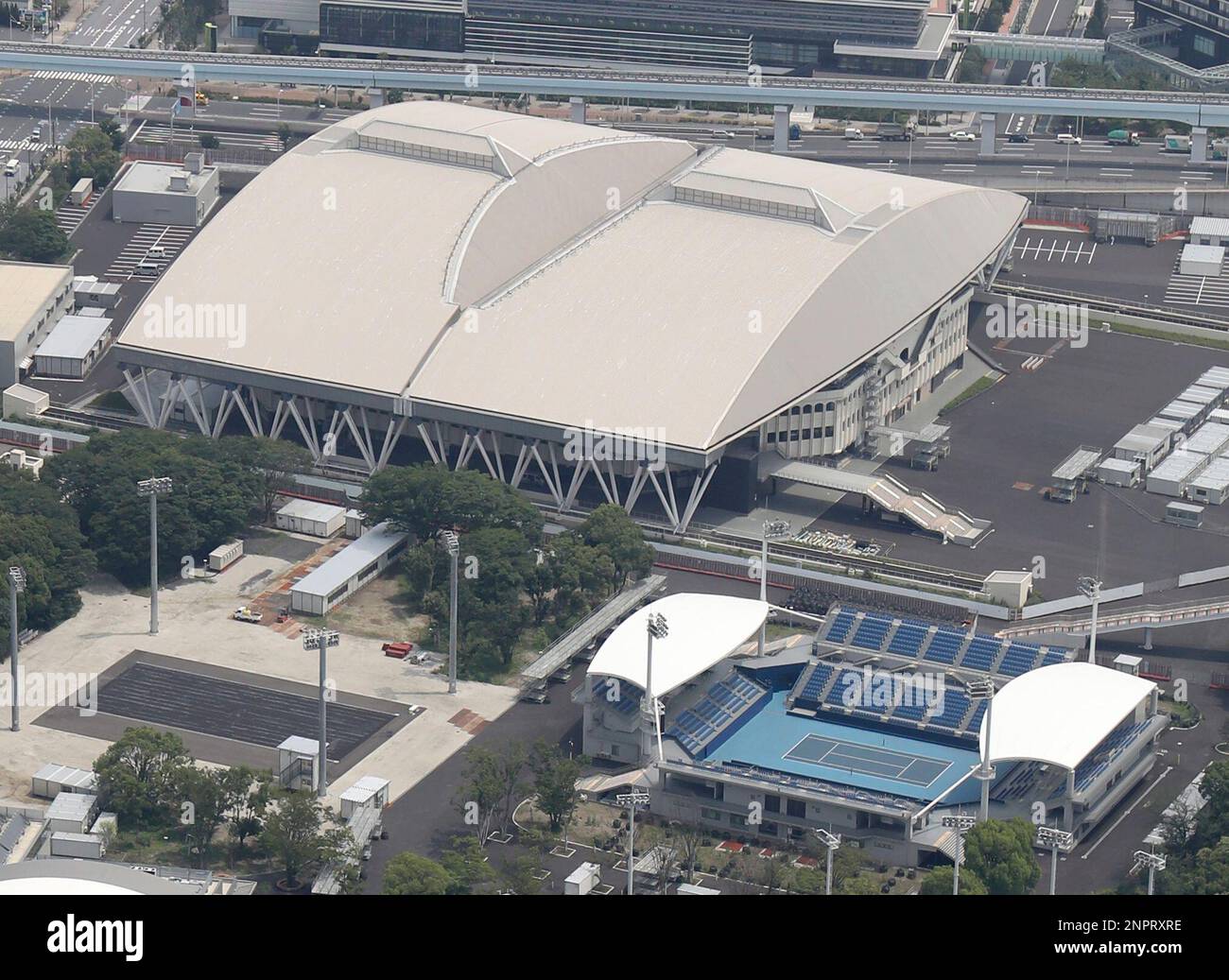 An aerial photo shows the center court (above) of Ariake Tennis Park in ...