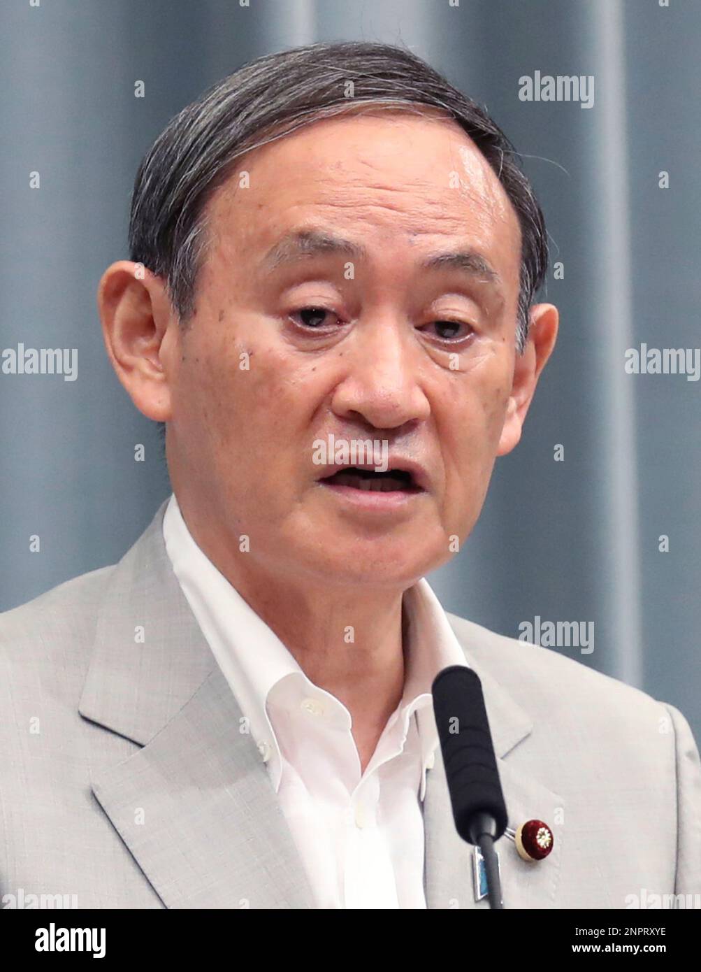 Japan's Chief Cabinet Secretary Yoshihide Suga attends a press ...