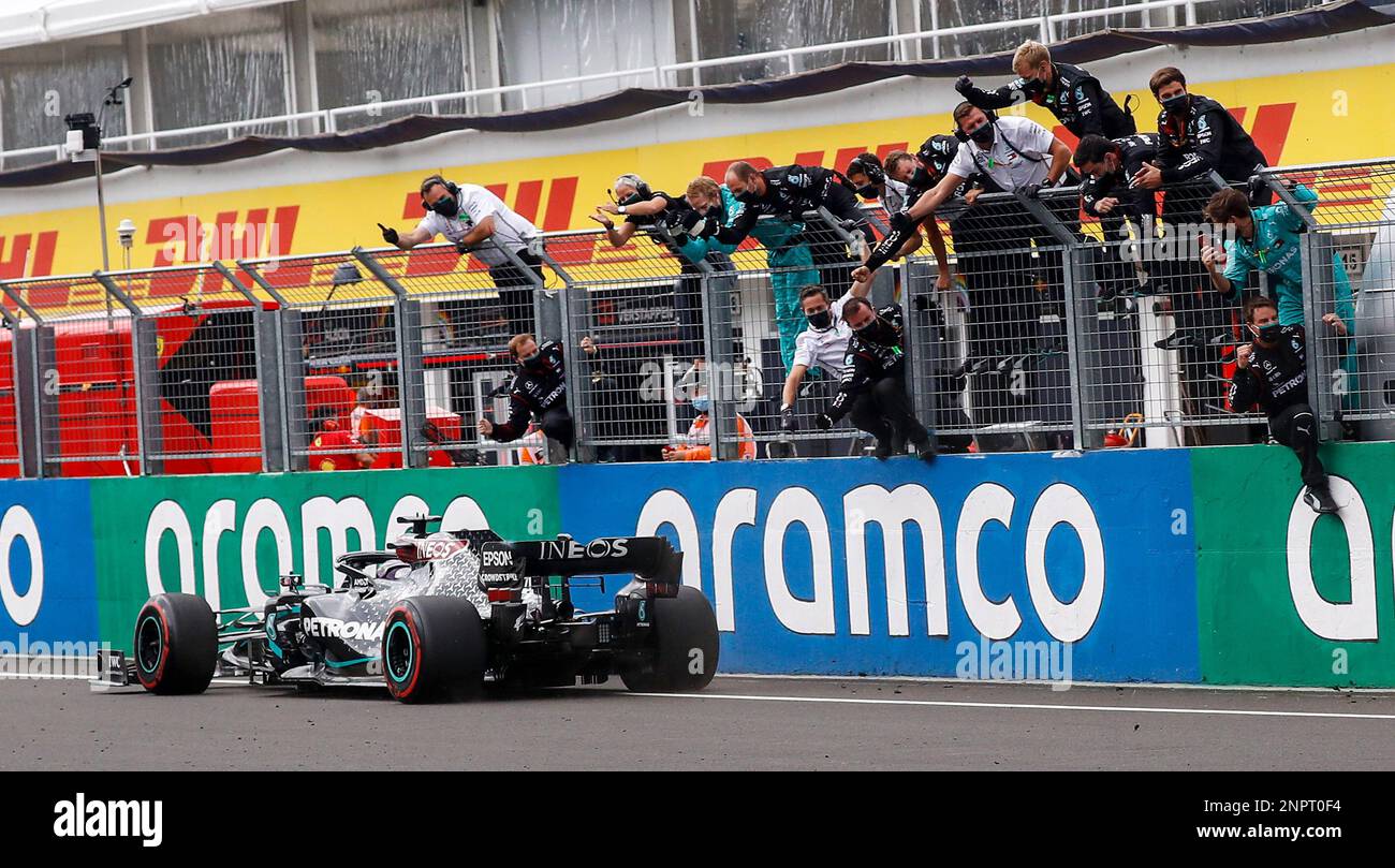 Mercedes driver Lewis Hamilton of Britain crosses the finish line in ...