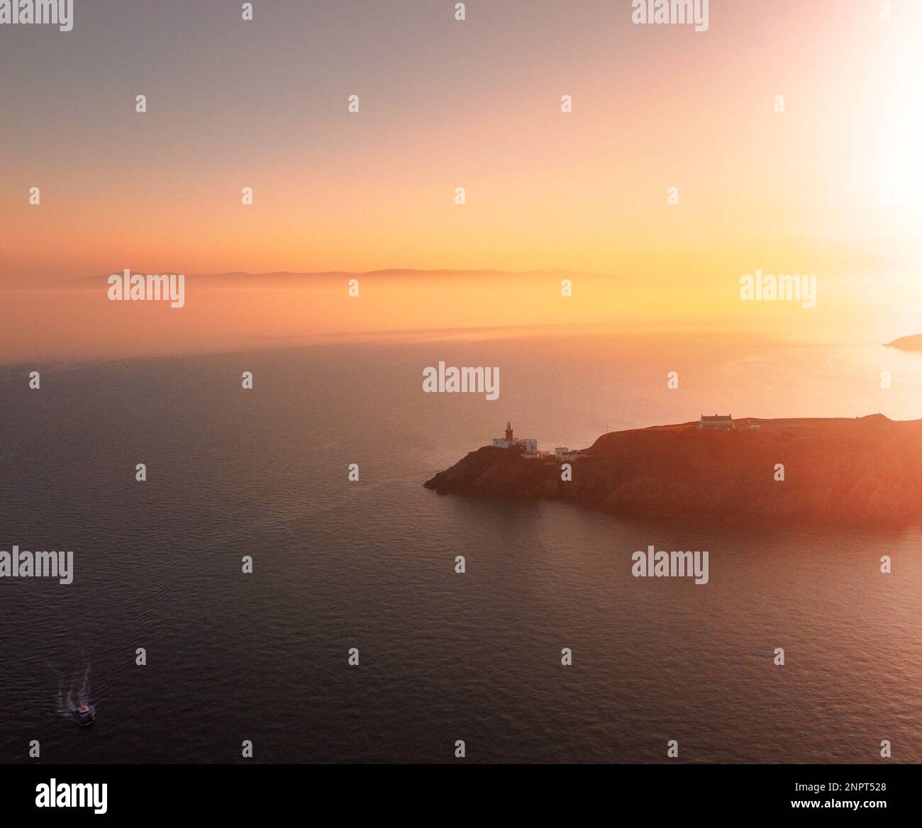 Misty sunset with distant fog from Howth Summit Stock Photo - Alamy