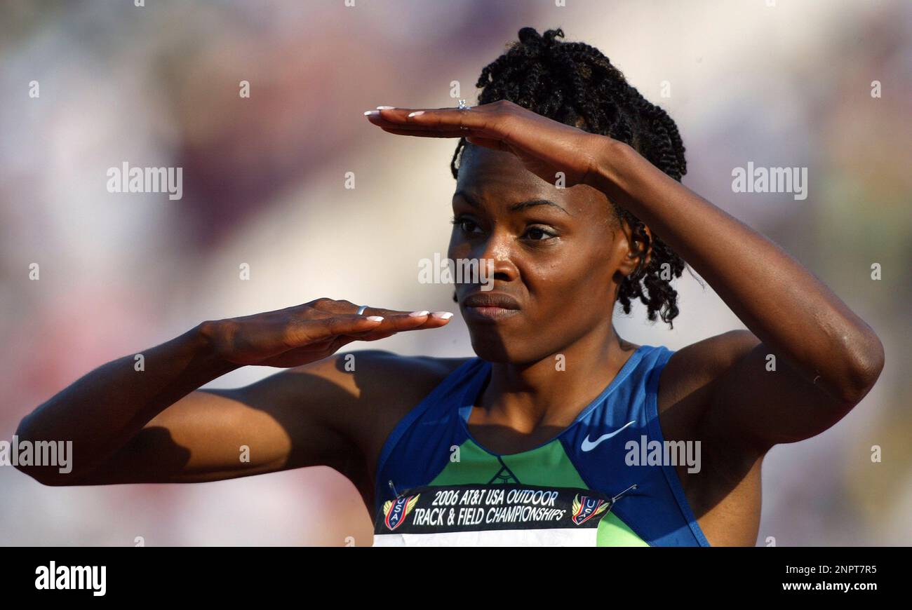Chaunte Howard confers with coach Nat Page during the women's high jump ...