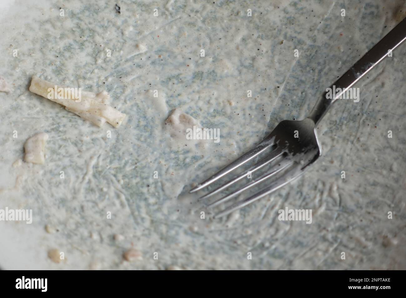 Empty plate after eating on table Stock Photo - Alamy