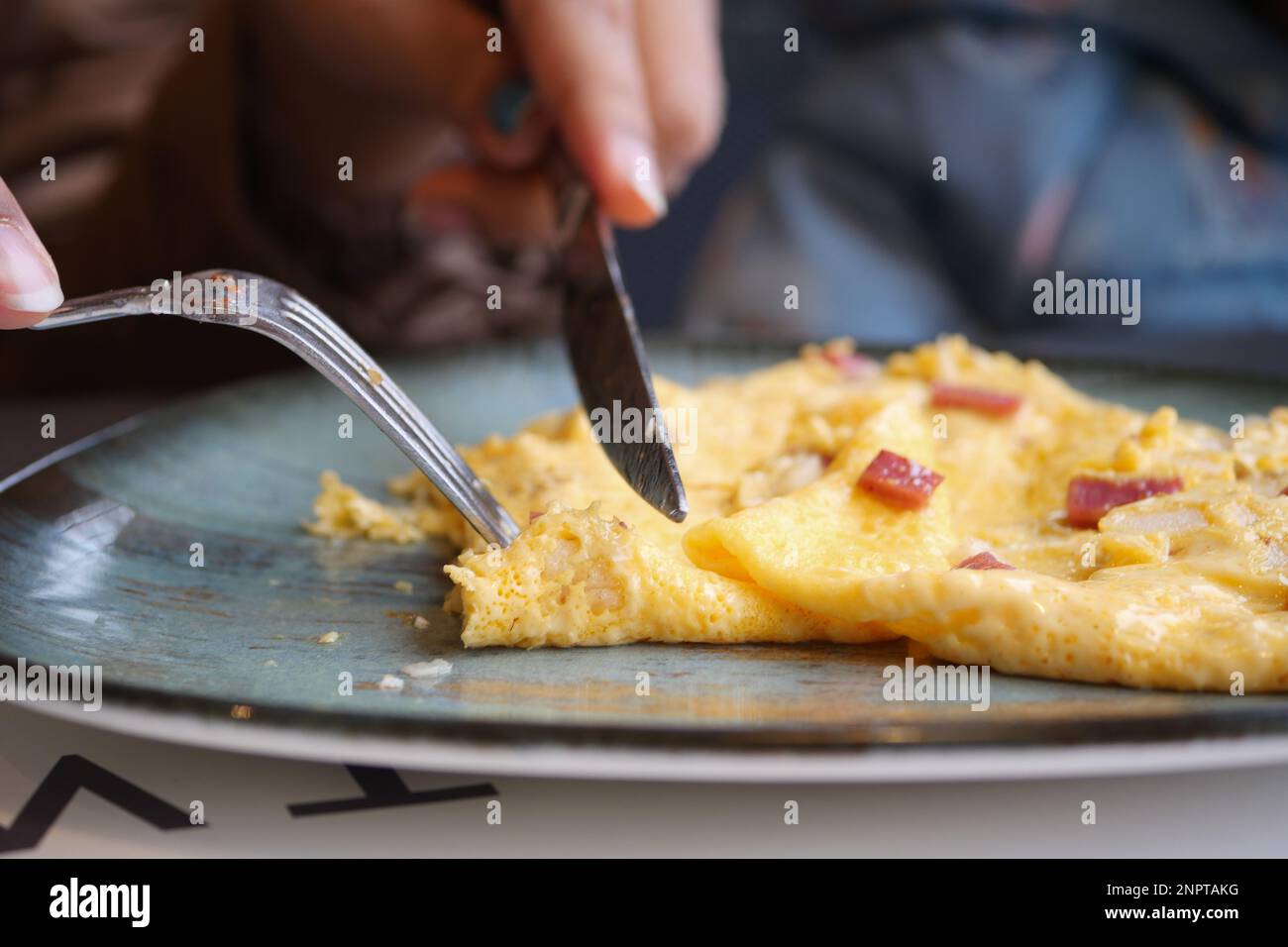 women eating Plain Egg Omelette Stock Photo - Alamy