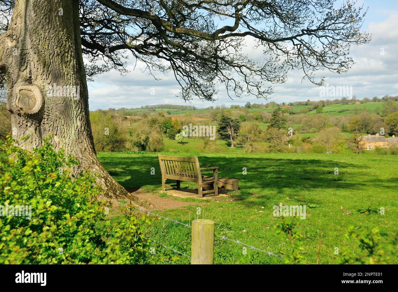 British countryside with bench in springtime Stock Photo - Alamy