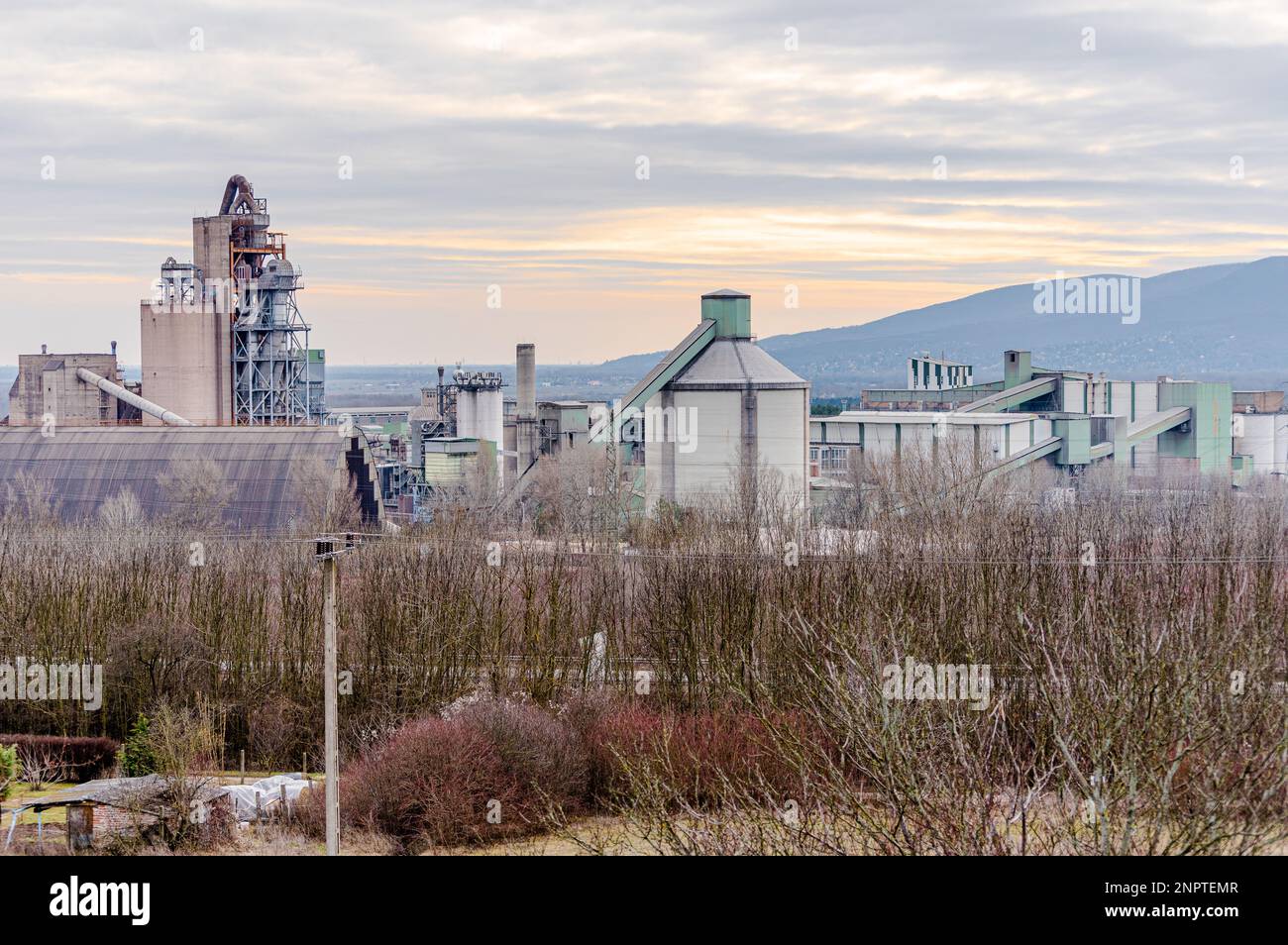 view of the buildings and chimneys of a large factory Stock Photo - Alamy