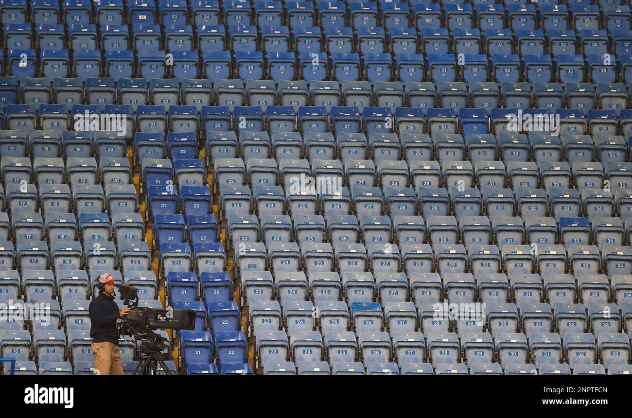A television cameramen films in front of the empty stands ahead of the ...