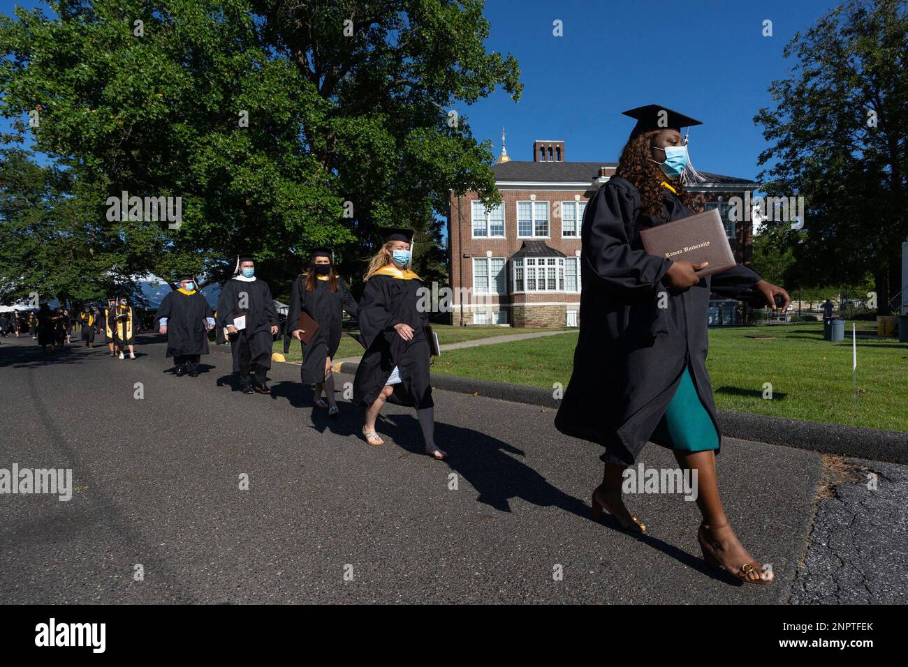 Geralda Saint-Jean, right, front shown here walking across campus with ...