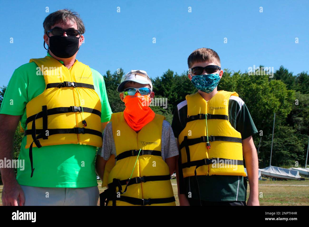 Nathan Hartman of Hudson, Ill., poses with sons Austin, 11, and Connor ...