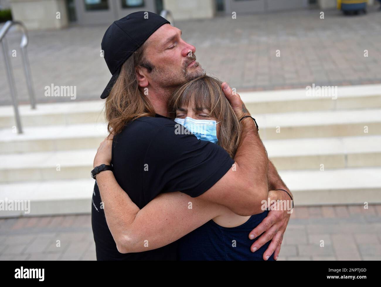 Shawn Henning, left, hugs Lori Freedman, a social worker at Centurion ...