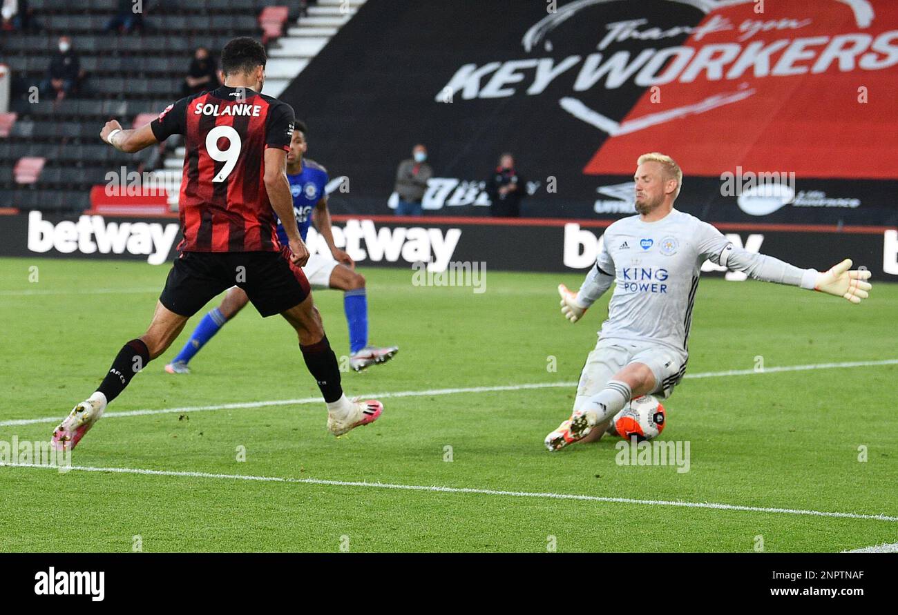 Bournemouth's Dominic Solanke, left, kicks the ball past Leicester's ...