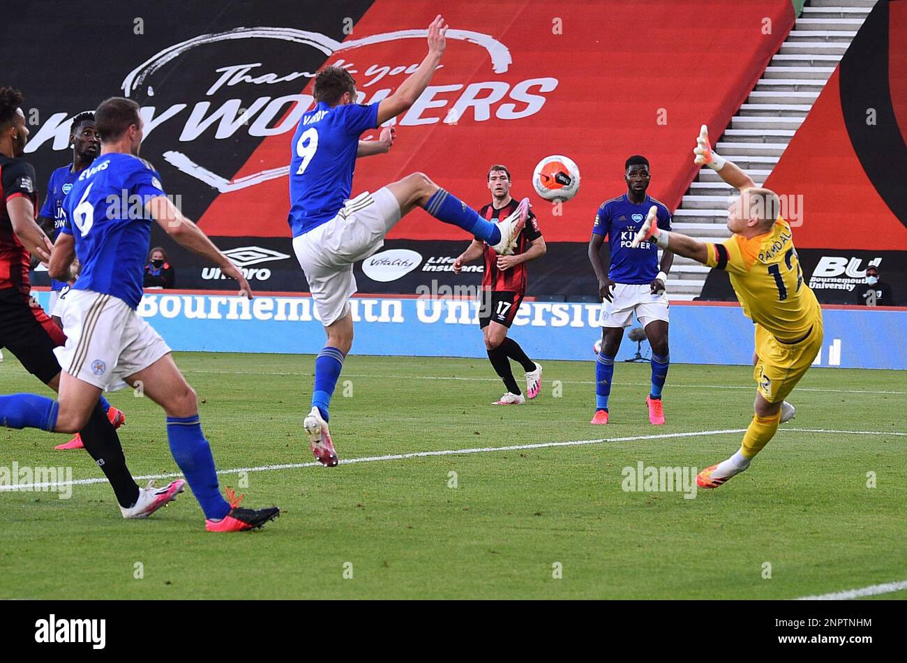 Leicester's Jamie Vardy, centre, kicks at the ball during the English ...