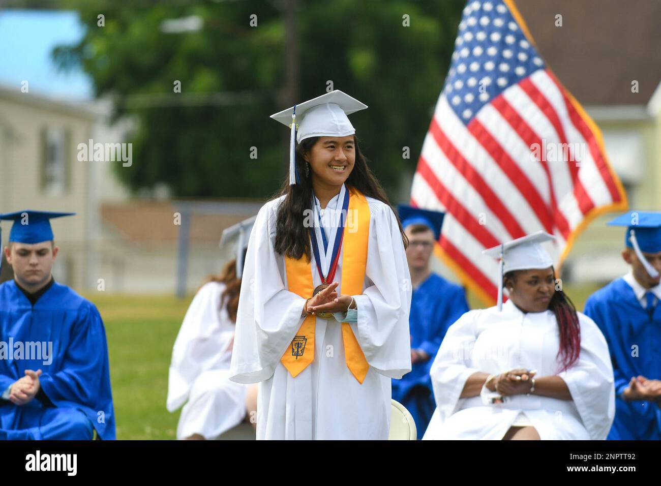 Regina Yeung, class president, stands as she is recognized during the ...