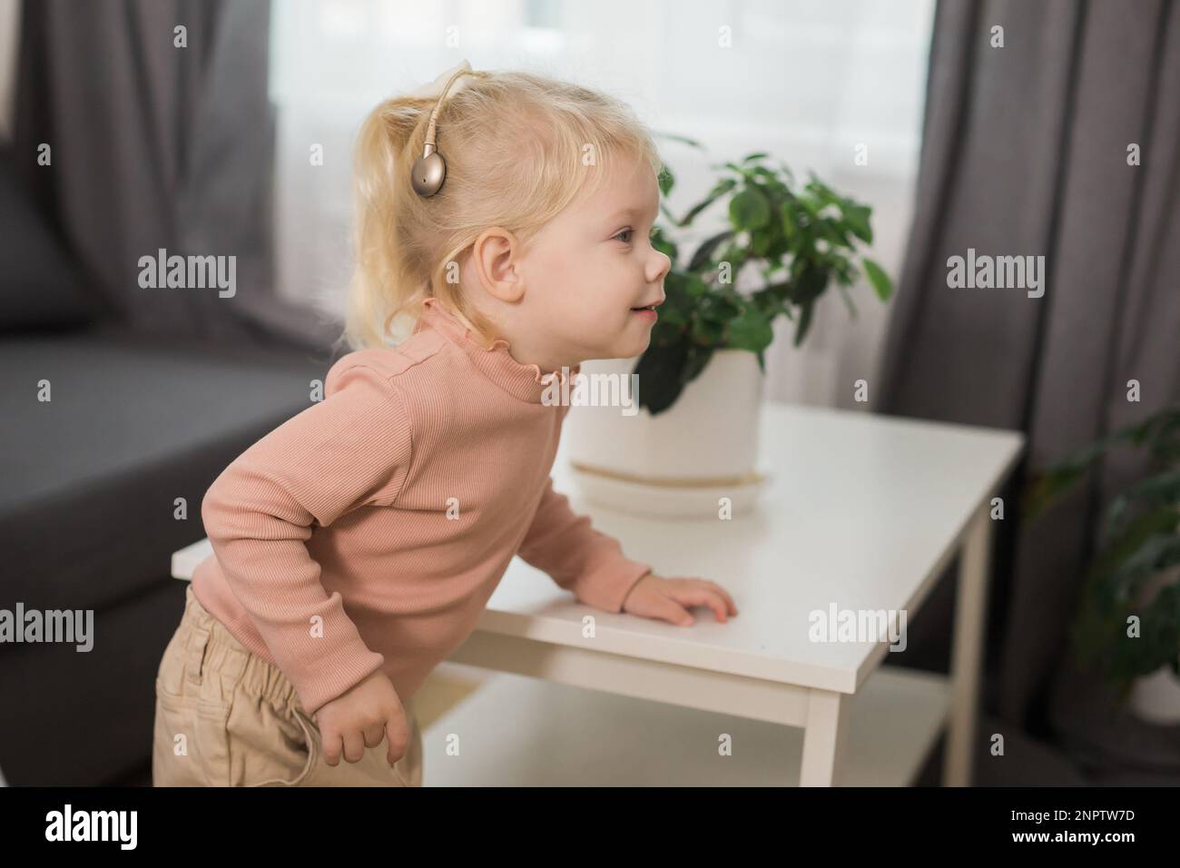Cochlear implant system. Installation cochlear implant on child girl ...