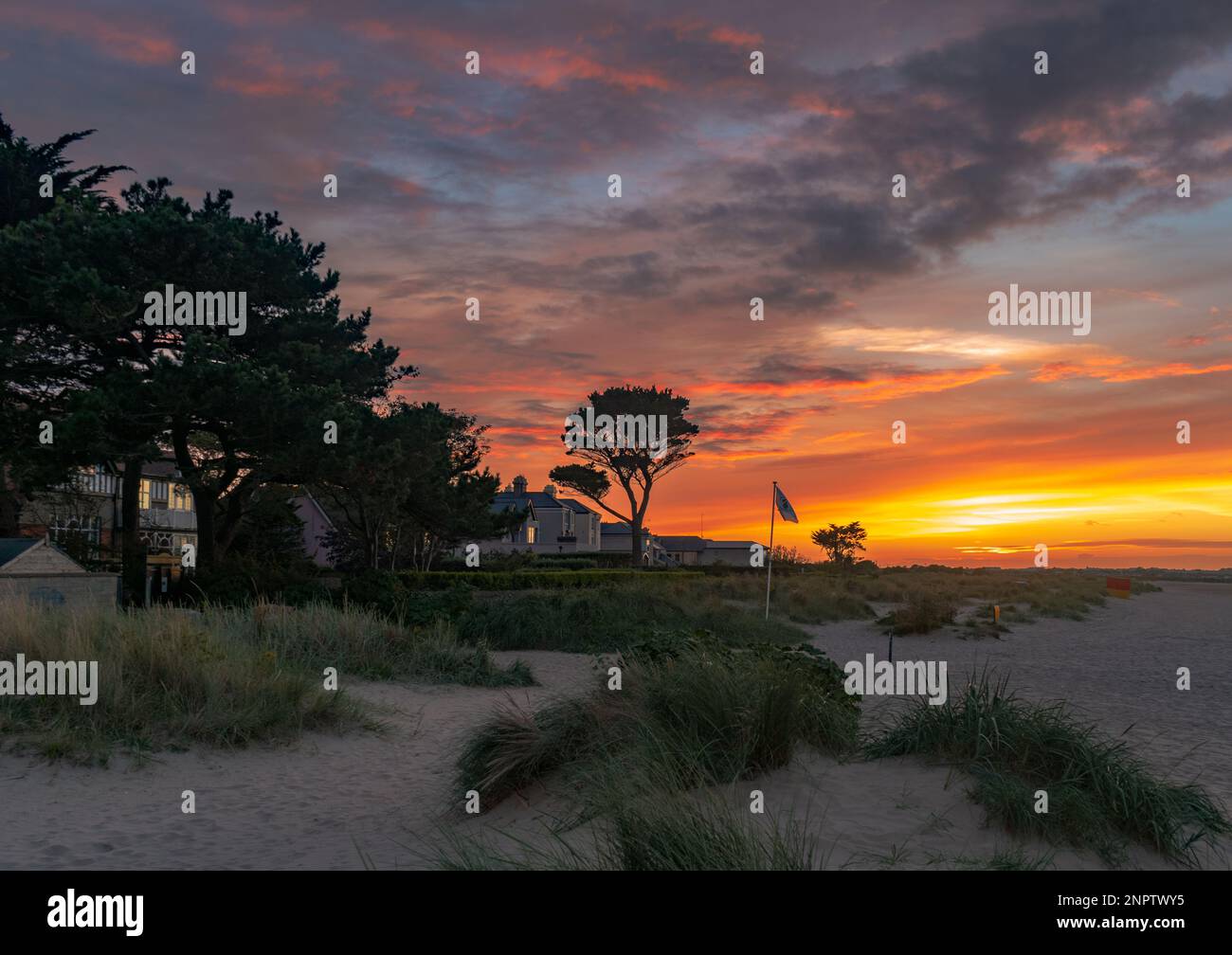 Sunset afterglow at Burrow Beach as a result of californian wildfire ...
