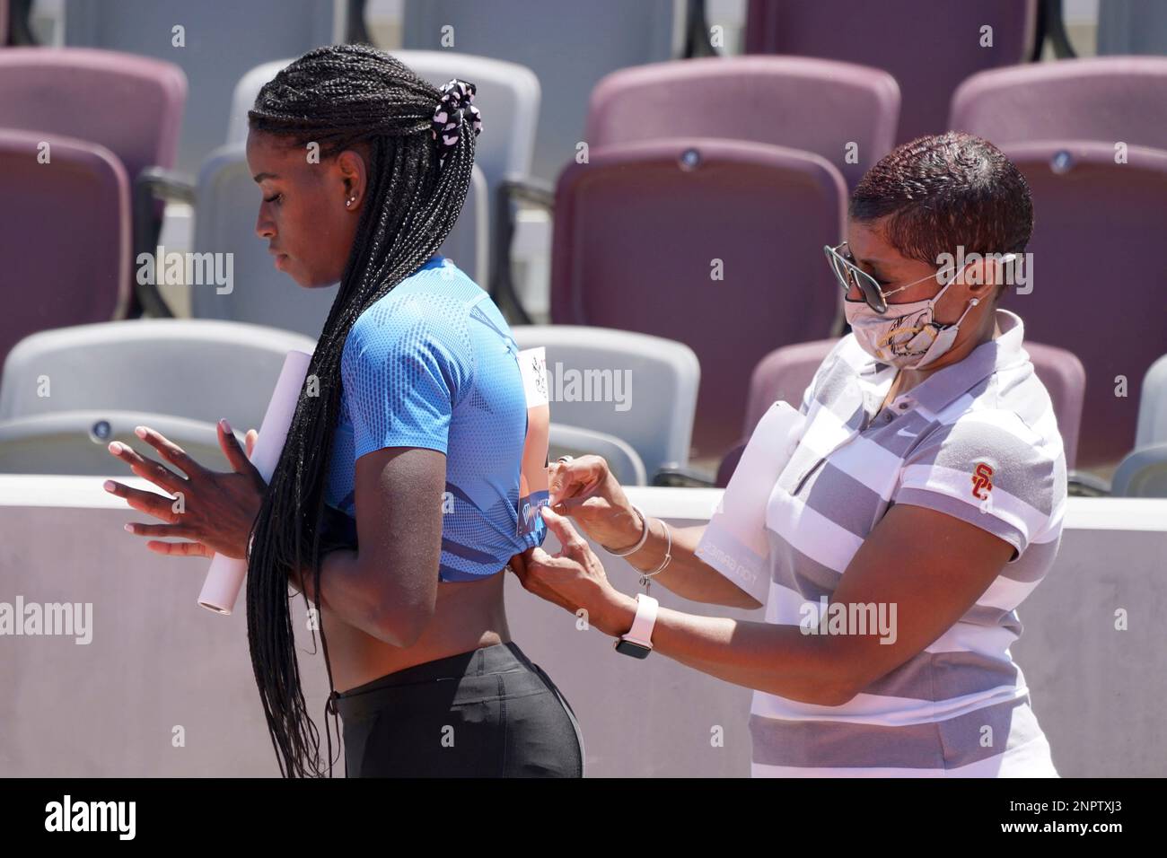 Southern California Trojans coach Caryl Smith Gilbert (right) assists ...