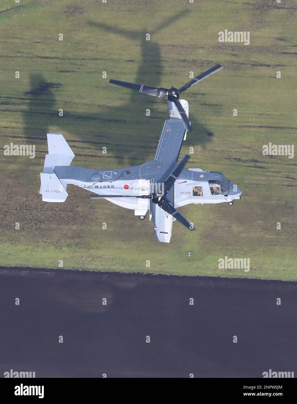 An aerial photo shows a Bell Boeing V-22 Osprey of Japan Ground Self ...