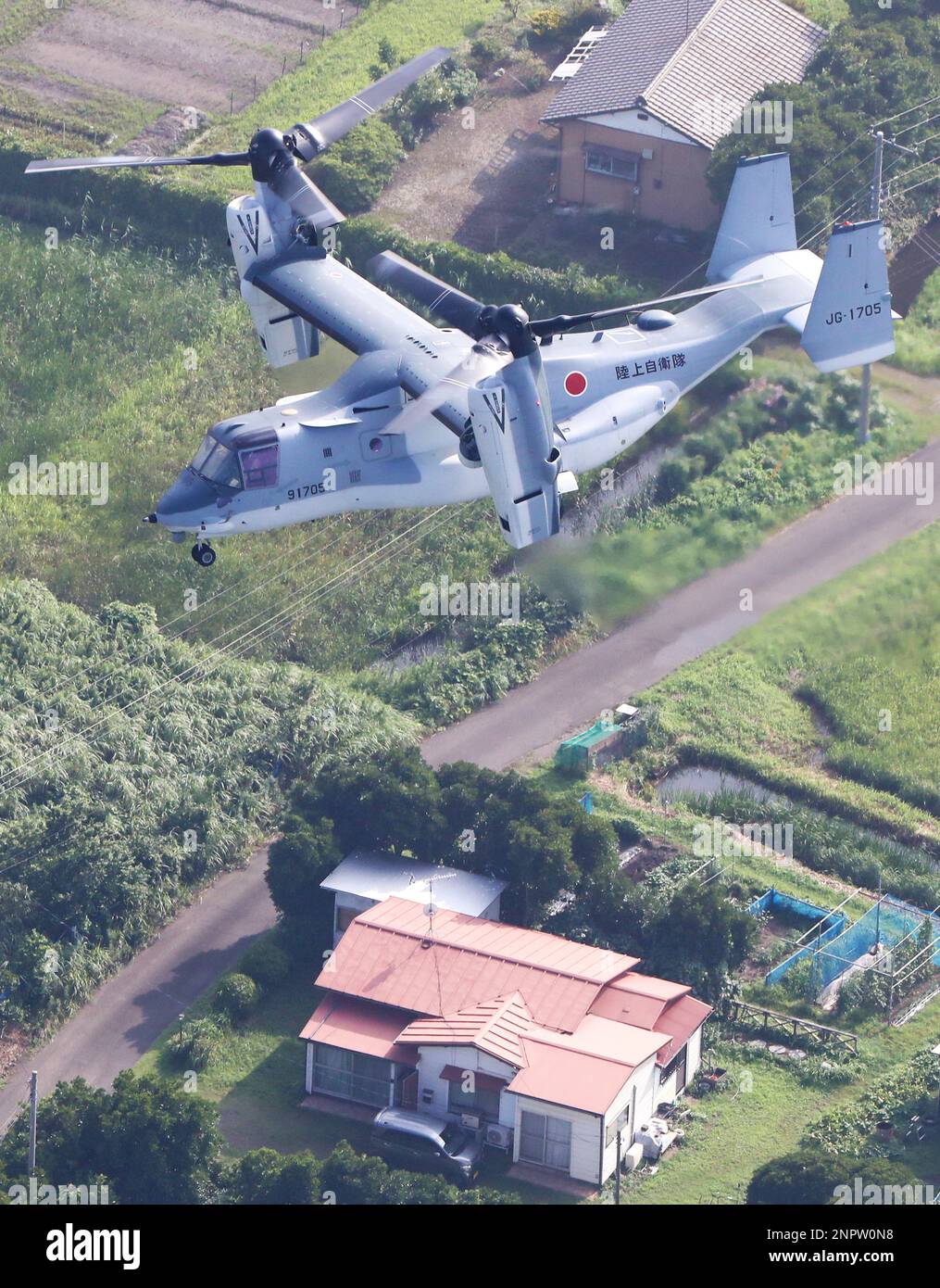 An aerial photo shows a Bell Boeing V-22 Osprey of Japan Ground Self ...