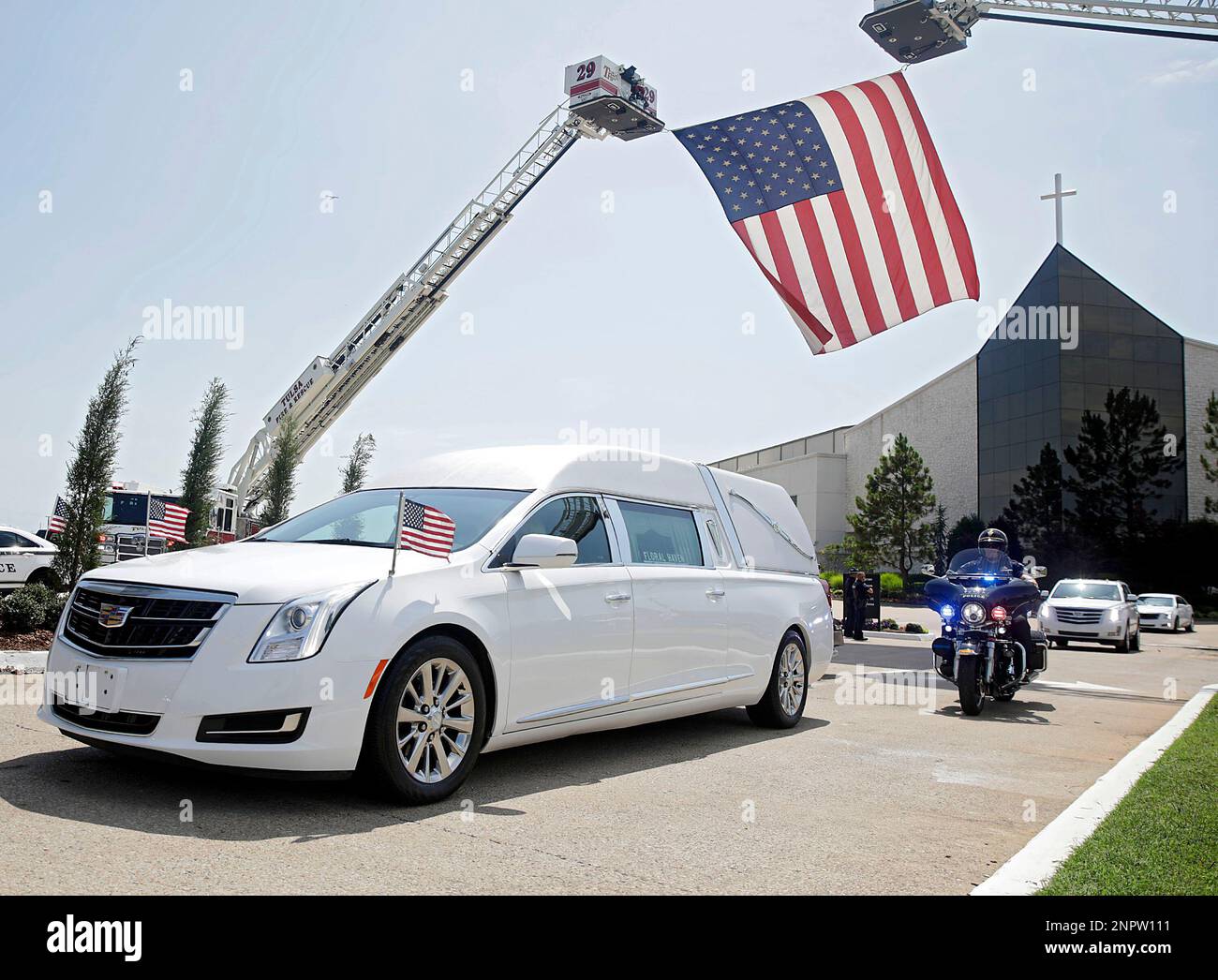 The hearse carrying the body of Tulsa Police Sgt. Craig Johnson leaves ...