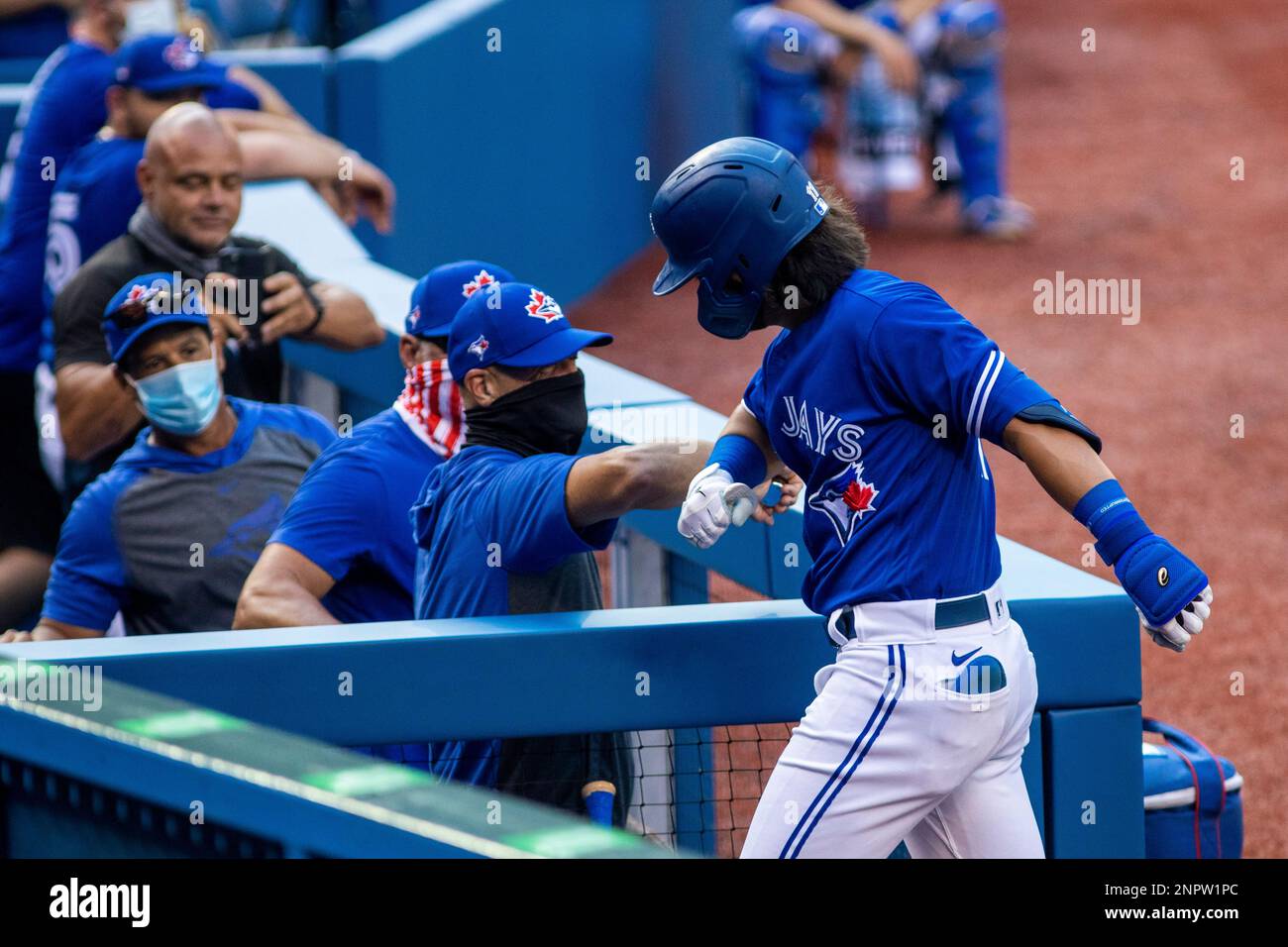 Toronto Blue Jays' Bo Bichette gets an elbow bump from coach Pete ...