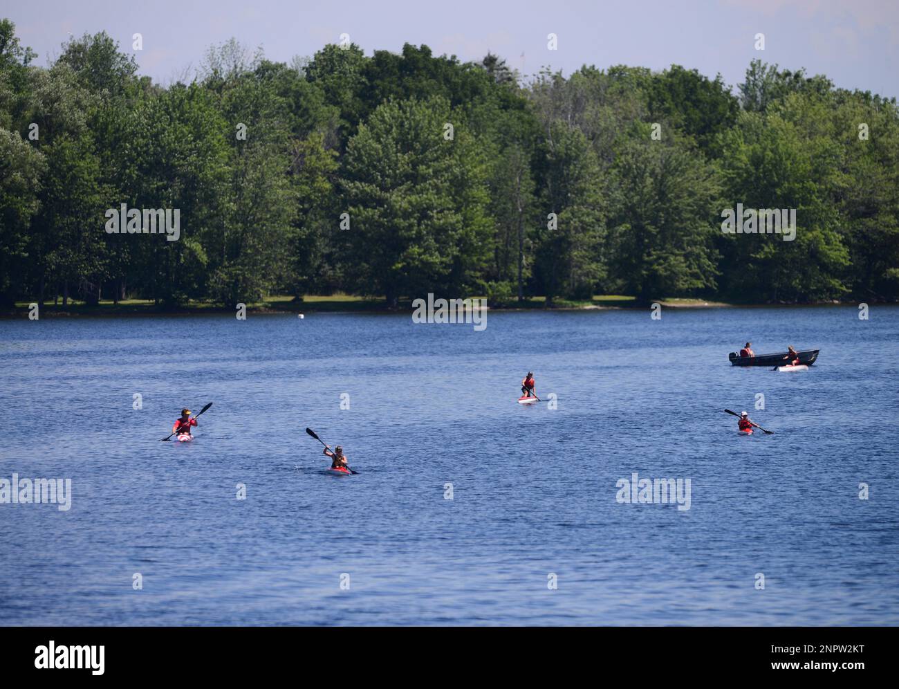 Young paddlers make their way along the Mississippi River as they take ...