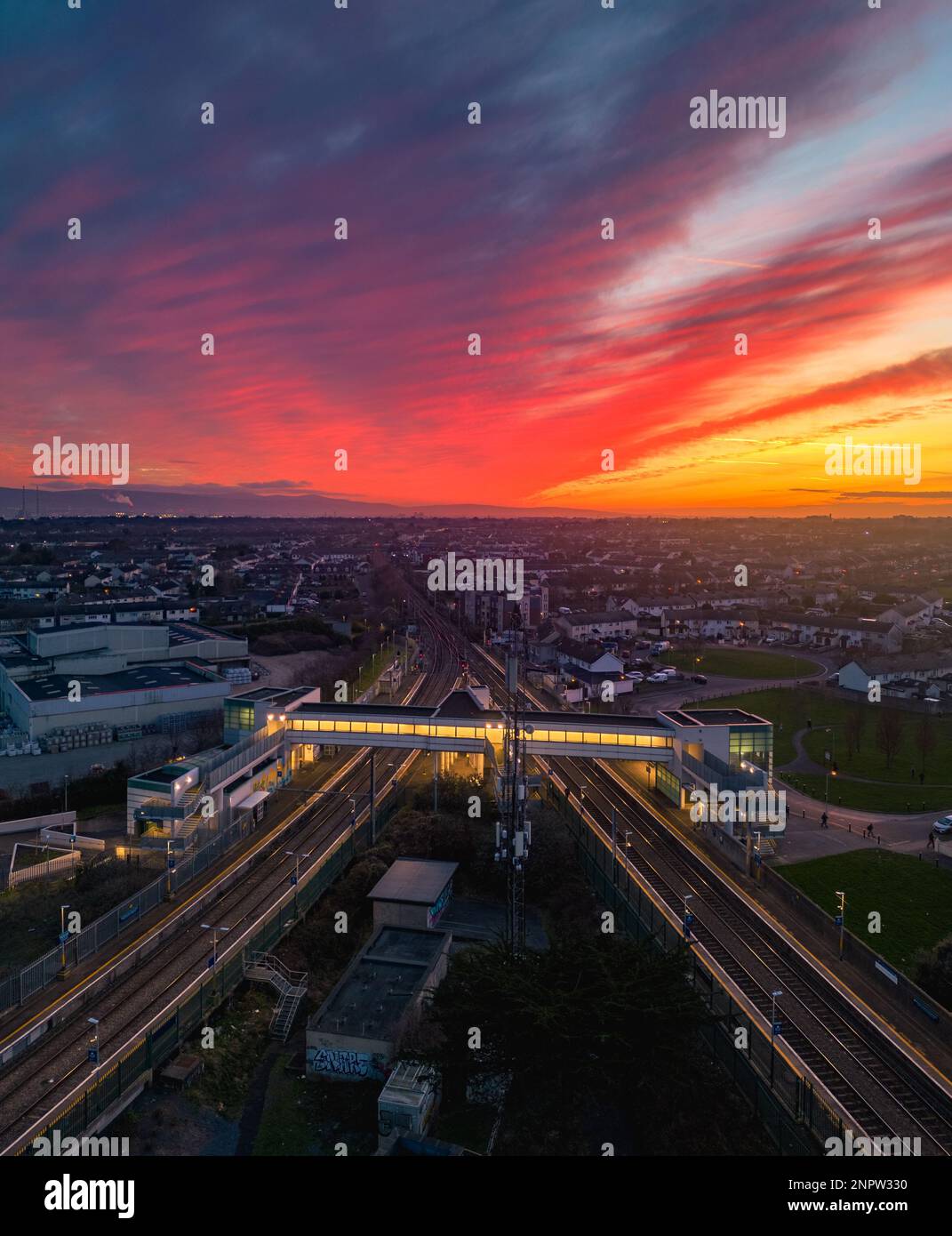 Fiery red sunset sky over Howth Junction & Donaghmede station Stock ...