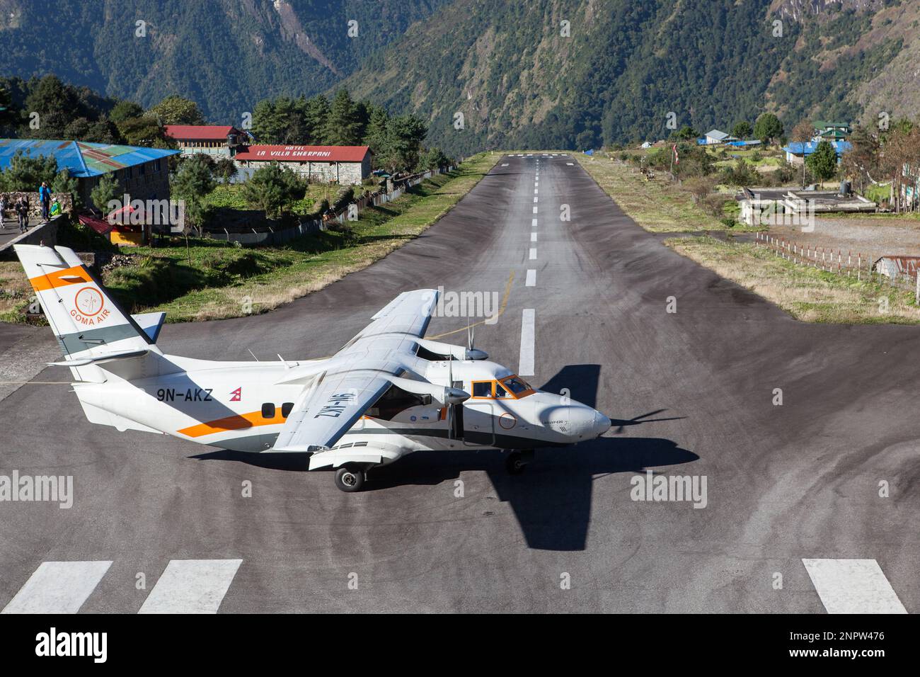 LUKLA/NEPAL - OCTOBER 18, 2015: Goma Air small airplane getting redy ...