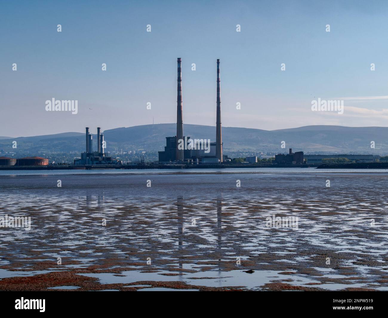 Poolbeg Chimneys reflection at Clontarf Stock Photo - Alamy
