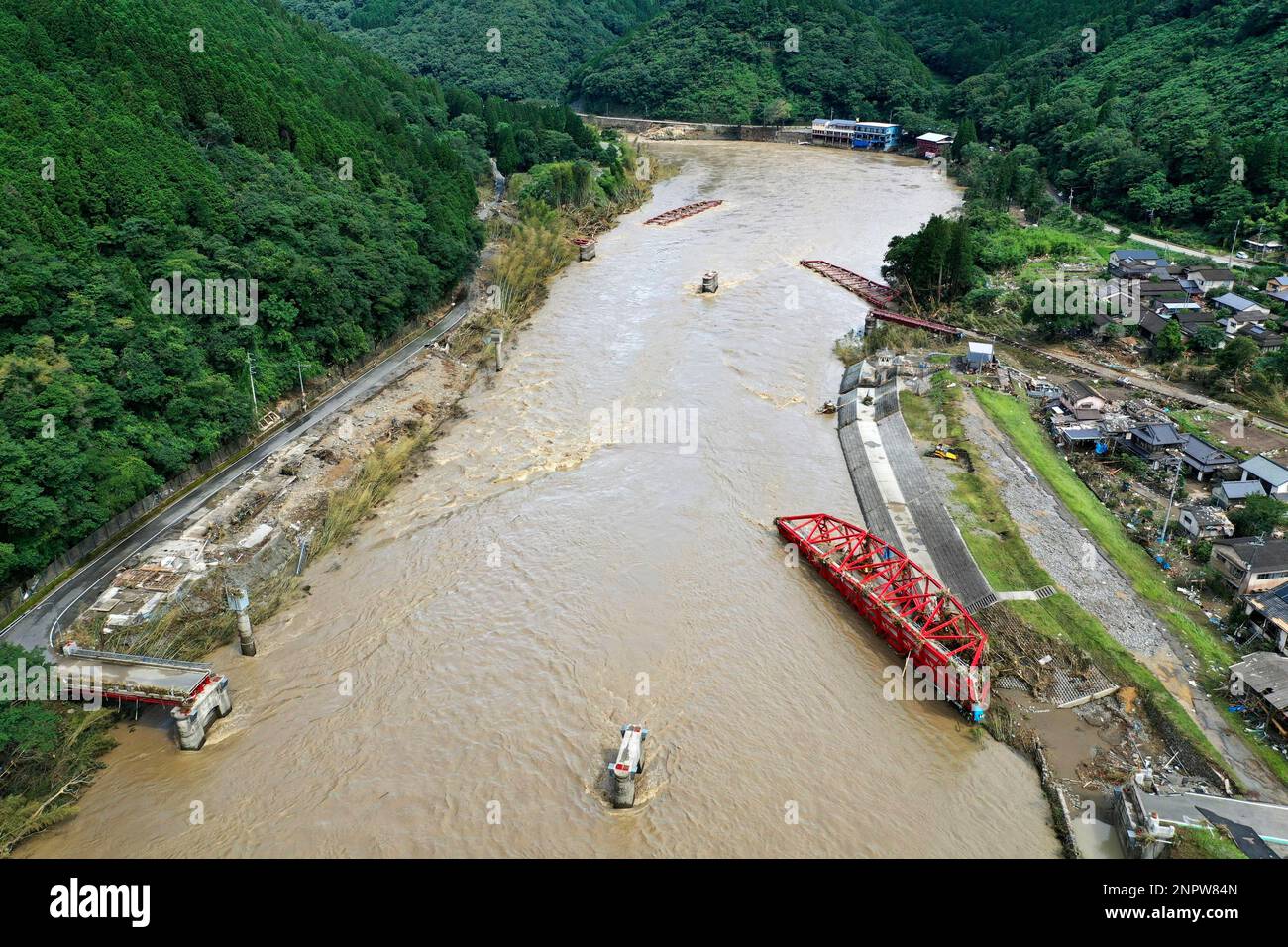 This aerial drone photo show the swollen Kuma River after heavy rains ...